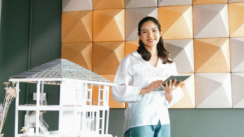 Beautiful Asian Project Manager Using Tablet Check House Model ...