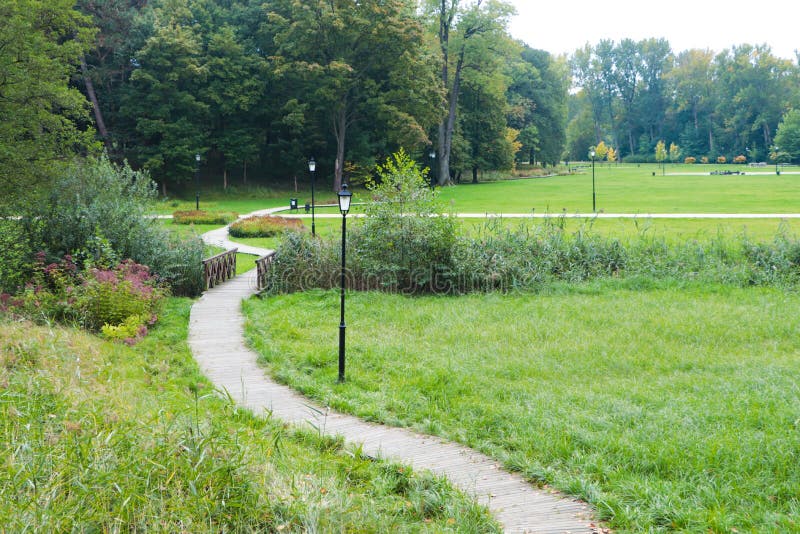 Beautiful Public City Park with Pathway and Green Grass Stock Photo ...