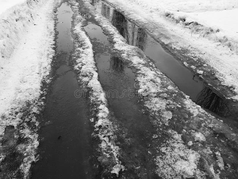 Beautiful Puddles with Ice Crust, Snow and Reflection in Winter or ...