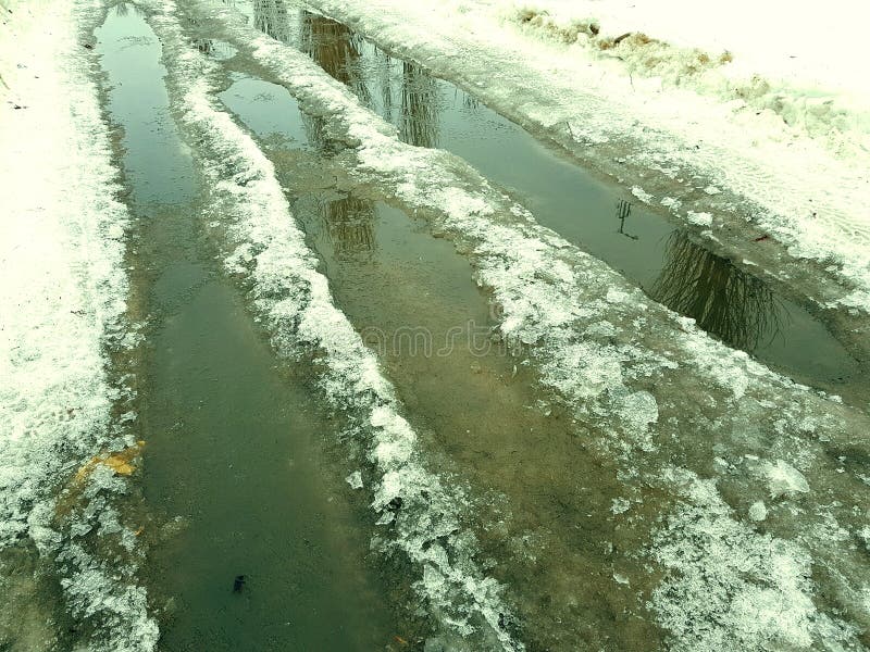 Beautiful Puddles with Ice Crust, Snow and Reflection in Winter or ...