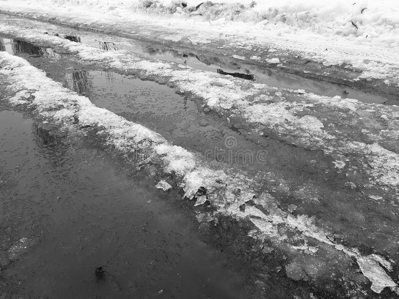 Beautiful Puddles with Ice Crust, Snow and Reflection in Winter or ...
