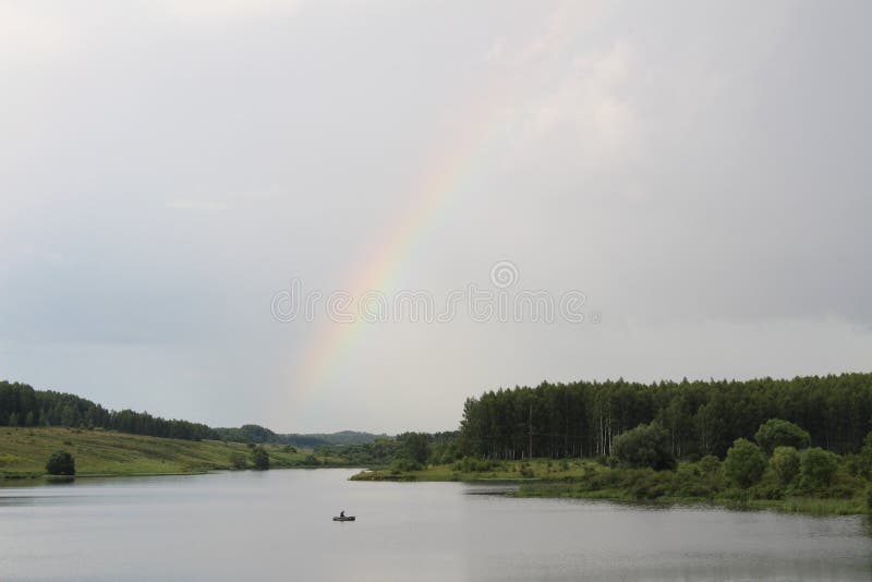 A Beautiful Rainbow that Appeared Above the Lake after the Rain Stock ...