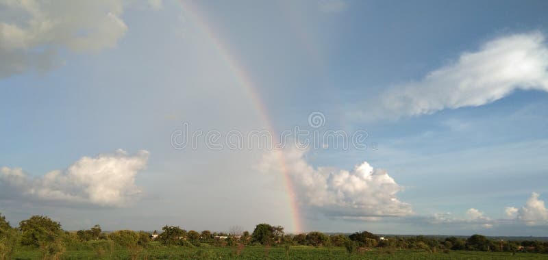 Beautiful Rainbow Blue Sky and Cloud and Green Plant Stock Image ...