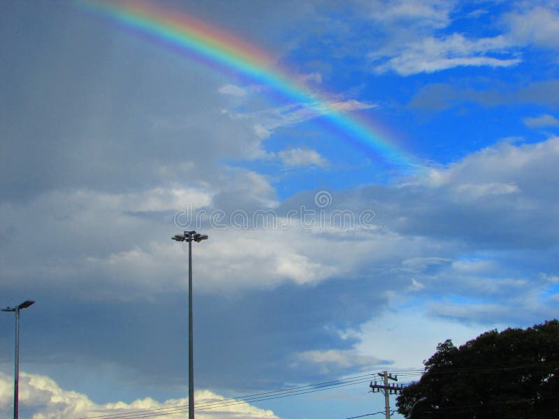 A Beautiful Rainbow in the Middle of the City Right after a Big Summer ...