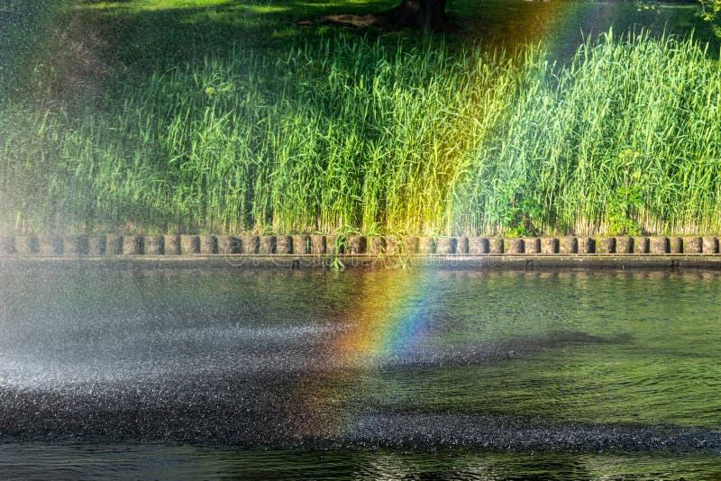 Beautiful Rainbow after the Rain Over the River in City Public Park ...