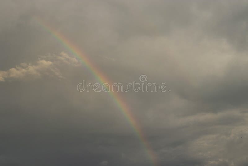 Rainbow View on a Cloudy Sky after Rain Over the Mountain Stock Image ...