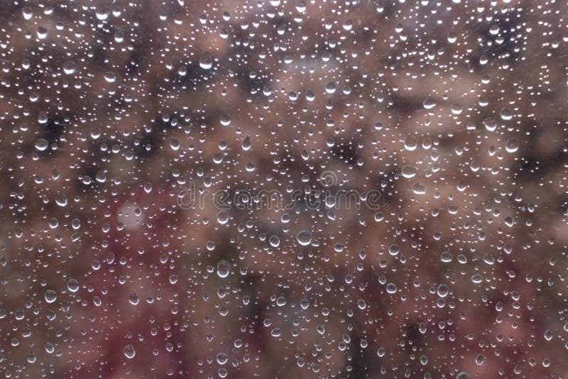 Beautiful Raindrops on Glass Window while Raining with Different ...