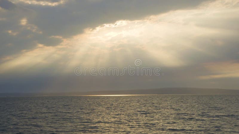 Beautiful Rays of the Sun Fall on the Surface of the Sea through Clouds ...