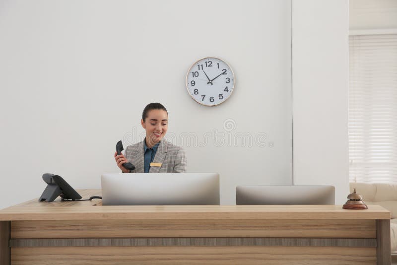 Beautiful Receptionist Working at Counter in Hotel Stock Image - Image ...
