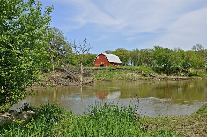 Beautiful Red Barn on the Eroding Banks of a River Stock Image - Image ...
