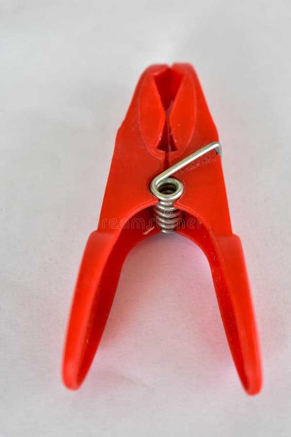 A Beautiful Red Clothes Peg with Metallic Spring Stock Image - Image of ...