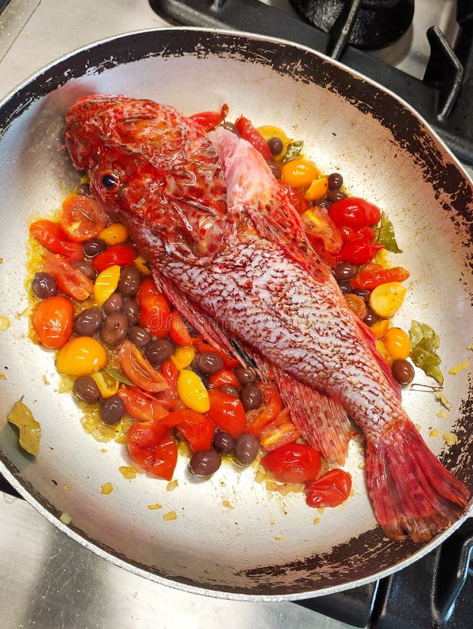 Beautiful Red Fish with Olives and Cherry Italian Tomatoes Stock Image ...