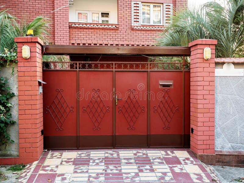 Beautiful Red Gates with Forging Elements on the Background of the ...