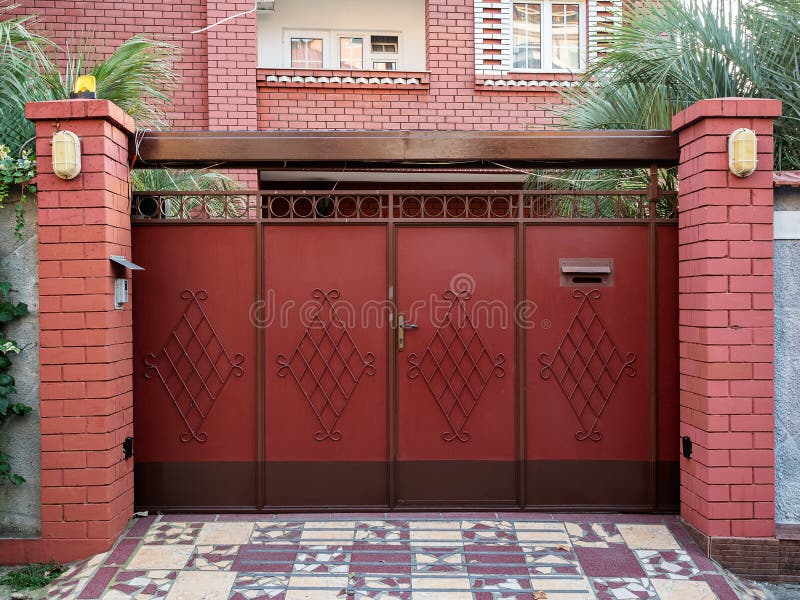 Beautiful Red Gates with Forging Elements on the Background of the ...