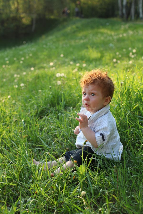 Beautiful Red-haired Boy on Grass Stock Image - Image of green ...