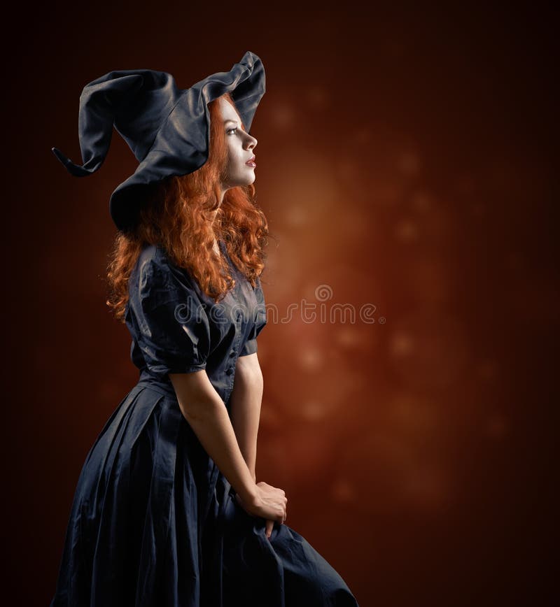 Beautiful Red-haired Girl in a Costume Witch Stock Photo - Image of ...