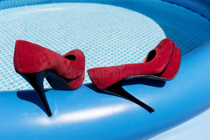 Red High Heels on the Edge of the Swimming Pool Stock Image - Image of ...