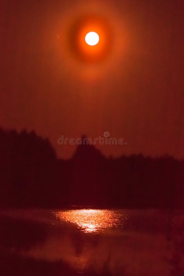 Beautiful Red Moon in the Night Sky Reflected in the Water. Stock Photo ...