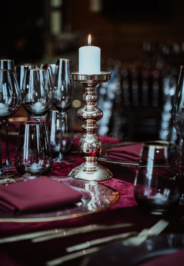 Beautiful Red Table Setting with Luxurious Tableware and a Candle in a ...