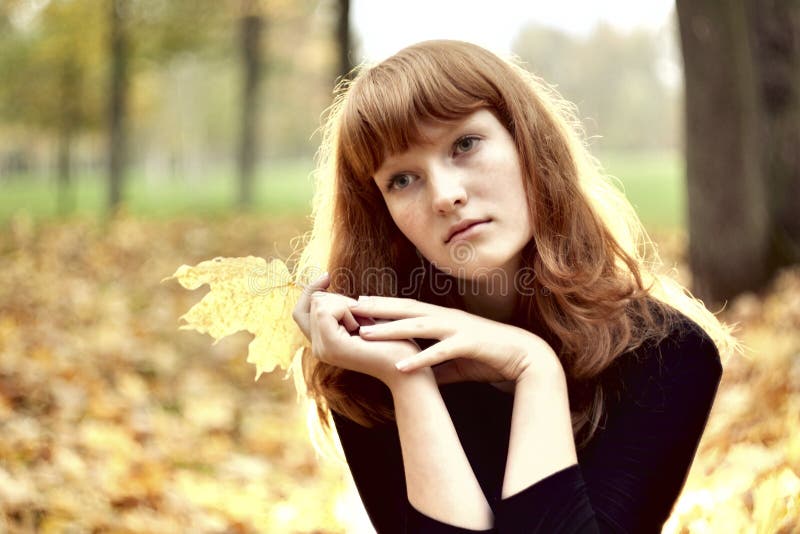 Beautiful Redhaired Girl Sitting Alone Stock Image - Image of beautiful ...