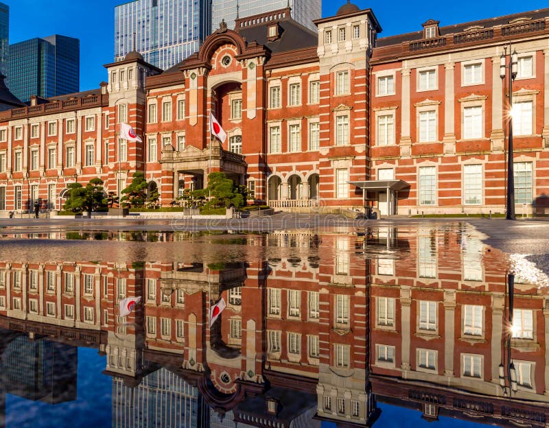 Beautiful Reflection of the Red Brick Tokyo Station in Water Sprayed To ...