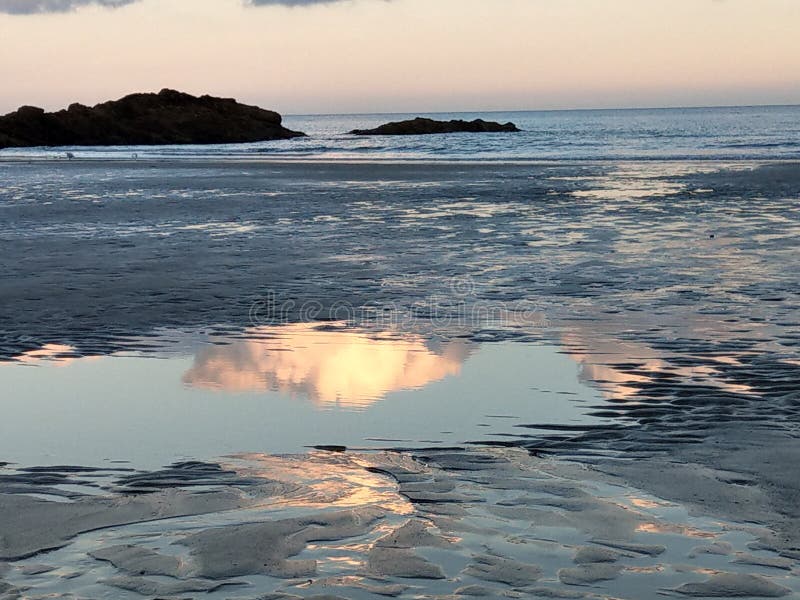 Beautiful Reflections in Water on the Beach Where the Tide Has Receded ...
