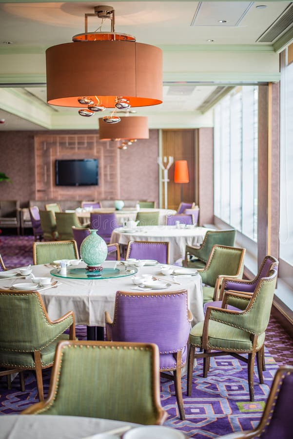 Beautiful Restaurant Interior with Round Tables and Colourful Seating ...