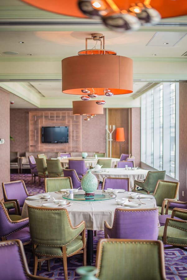 Beautiful Restaurant Interior with Round Tables and Colourful Seating ...