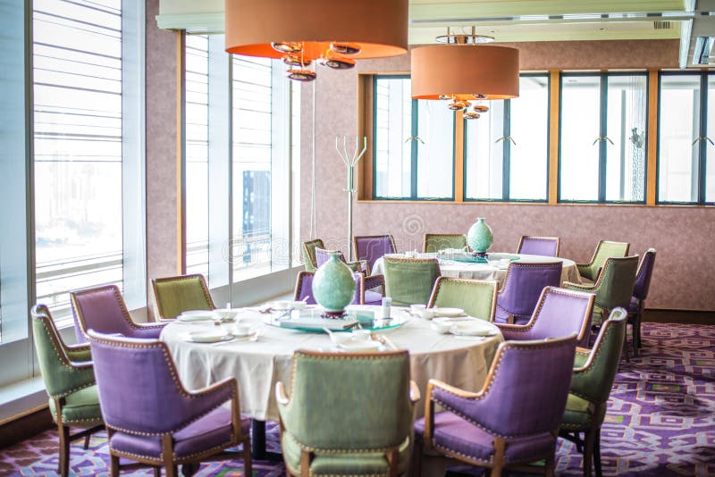 Beautiful Restaurant Interior with Round Tables and Colourful Seating ...