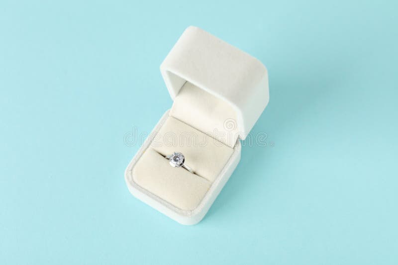 Beautiful Ring with Gemstone in Box on Light Blue Background, Above ...