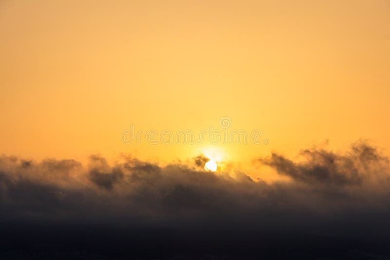 Beautiful Rising Orange Sun Above Clouds in Sky at Sunrise Stock Image ...