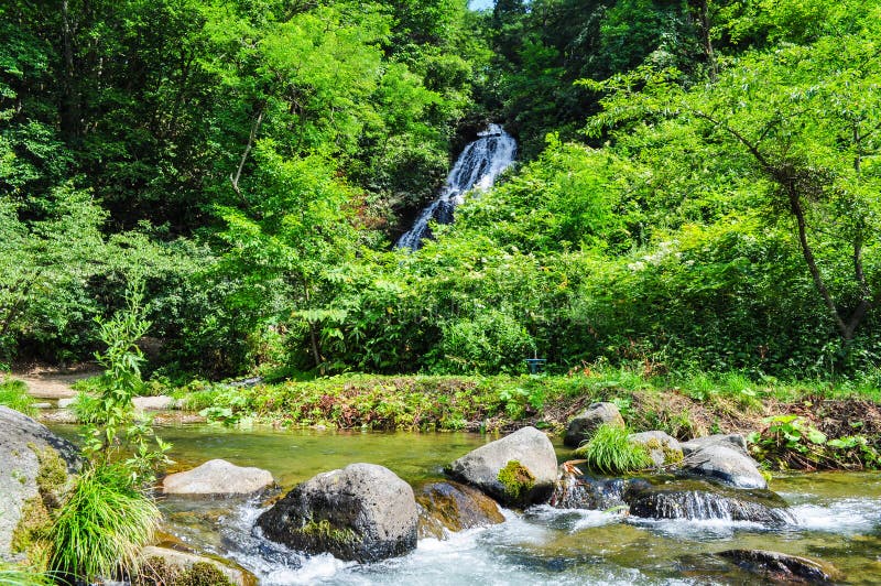 Beautiful River and a Waterfall in the Countryside in Japan Stock Image ...