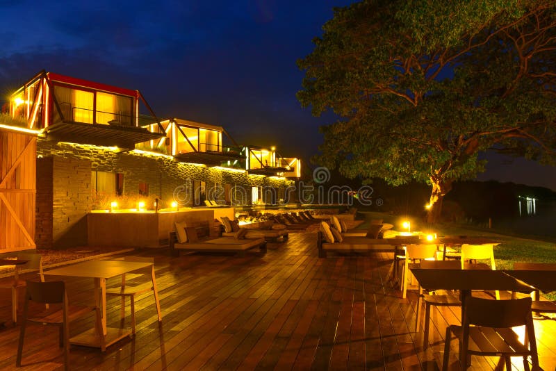 Beautiful Riverside Resort with Big Tree in Twilight Time Stock Photo ...