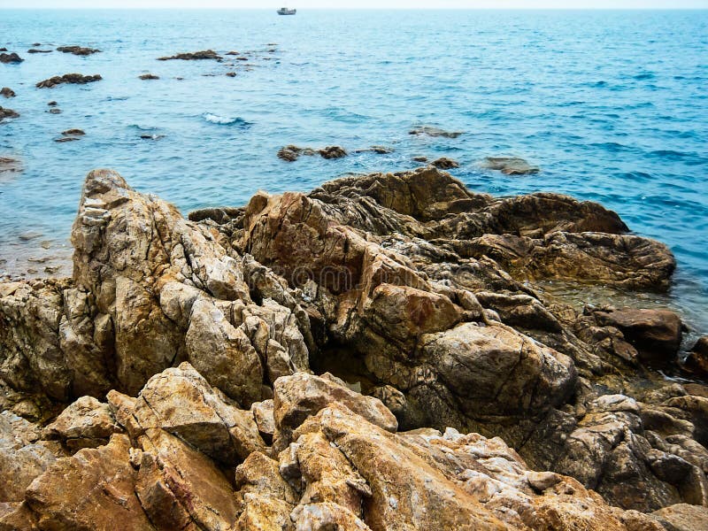Beautiful Rock and Lonely Small Ship on the Sea Stock Photo - Image of ...