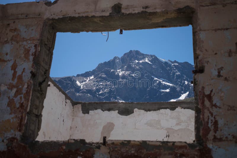 Beautiful Rocky Mountain Seen through a Square Shaped Opening from a ...