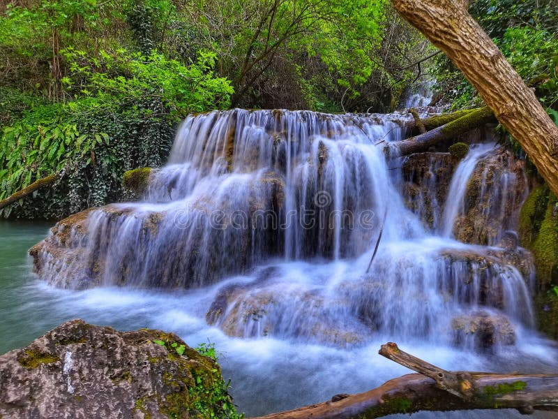 Beautiful Rocky Waterfall Flowing Downstream in a Forest Stock Photo ... Beautiful Rocky Waterfall Flowing Downstream in a Forest Stock Photo ...