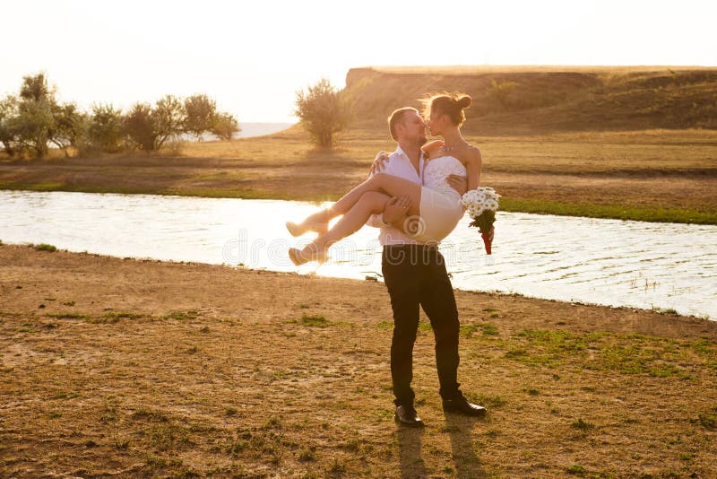 A Beautiful Romantic Couple Man Holding Woman In His Arms Stock Image