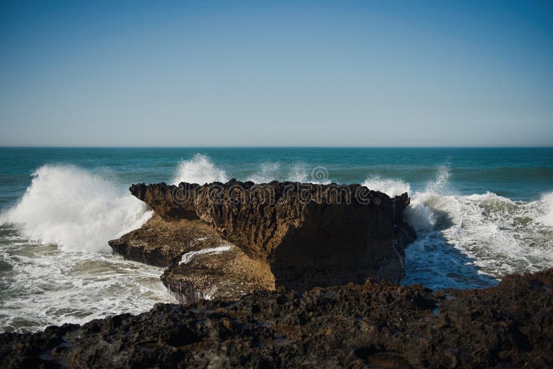 Beautiful Rugged Coastline with Waves Crashing Against the Cliffs Stock ...