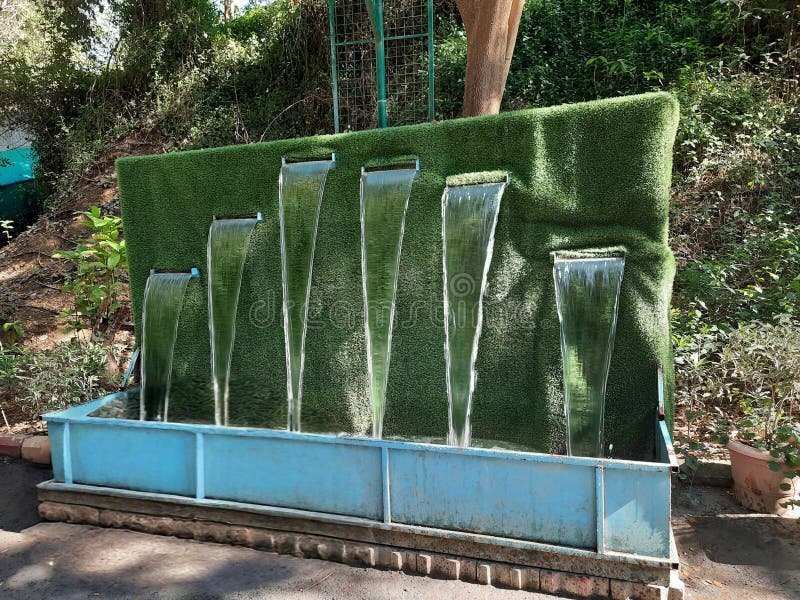 Beautiful Running Water Fountain from Green Grass Stock Image - Image ...