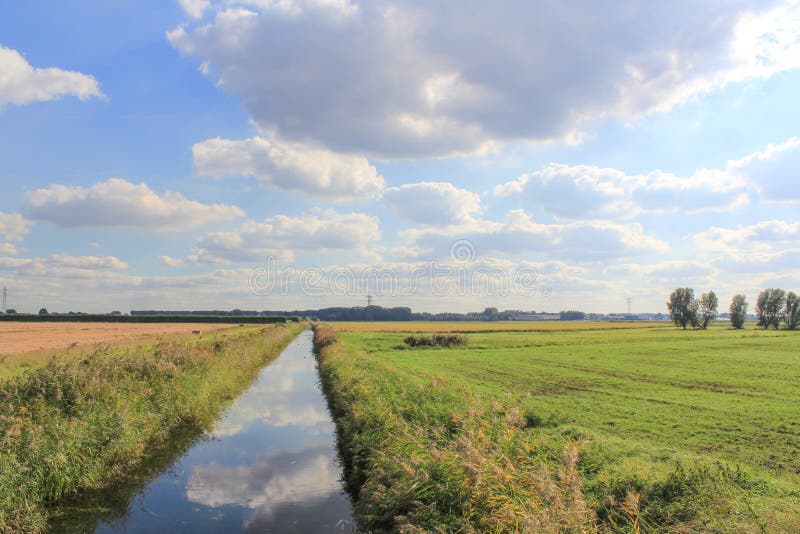 A Beautiful Rural Landscape with a Ditch and a Blue Cloudy Sky Stock ...