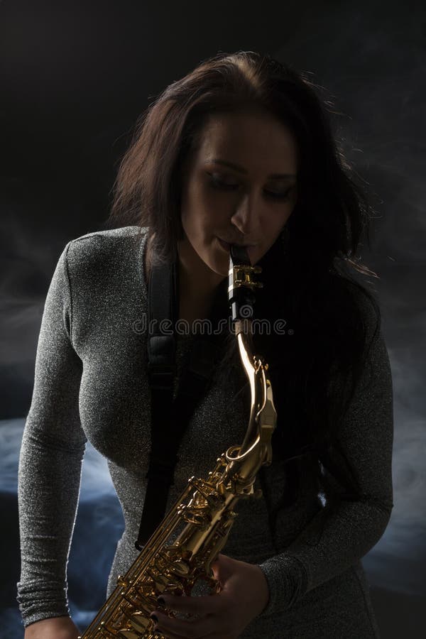 Beautiful Sax Player stock photo. Image of dark, gorgeous - 62680162