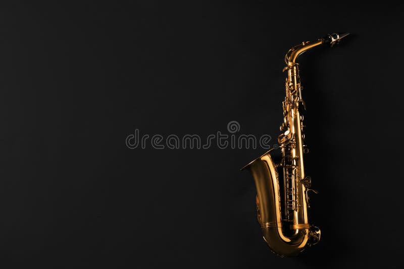 Beautiful Saxophone on Black Background, Top View. Space for Text Stock ...