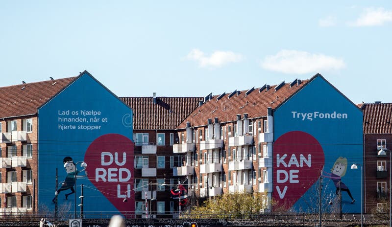 Beautiful Scene of a Building with White Balconies and Commercials on ...