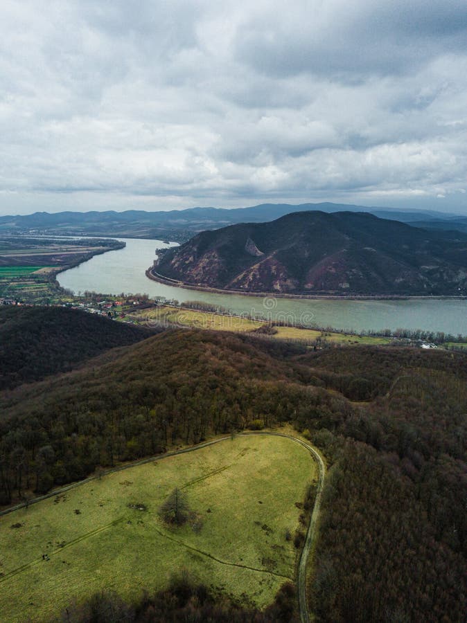 Beautiful Scene of a River between Hills and Forest Under the Cloudy ...