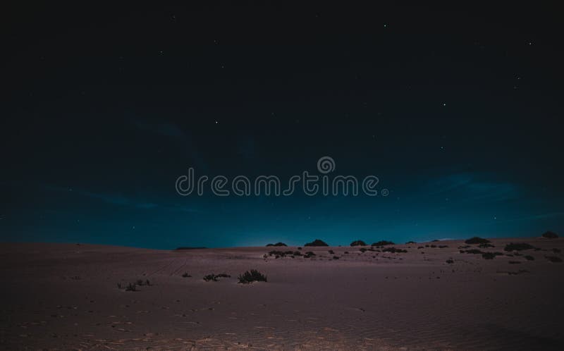Beautiful Scenery of the Blue Night Sky Over the Sandy Land Stock Photo ...