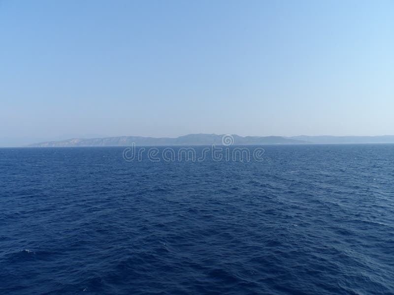 Beautiful Scenery of Calm Sea and Barely Visible Land on the Background ...
