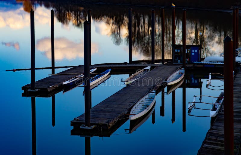 Beautiful Scenery of a Dock on the Side of a River with Mirror ...
