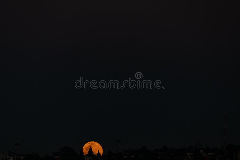 Beautiful Scenery of the Moon Over a Cityscape in the Night Dark Sky ...