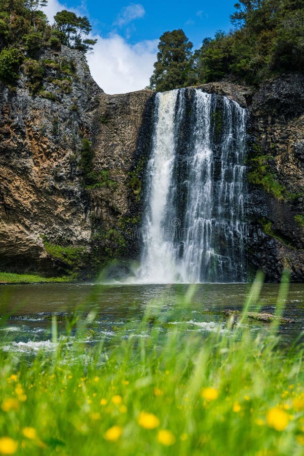 Beautiful Scenery of a Powerful Waterfall Flowing through a Cliff into ...