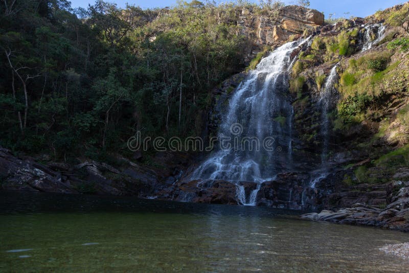 Beautiful Scenery of a Powerful Waterfall Surrounded by Greenery in ...